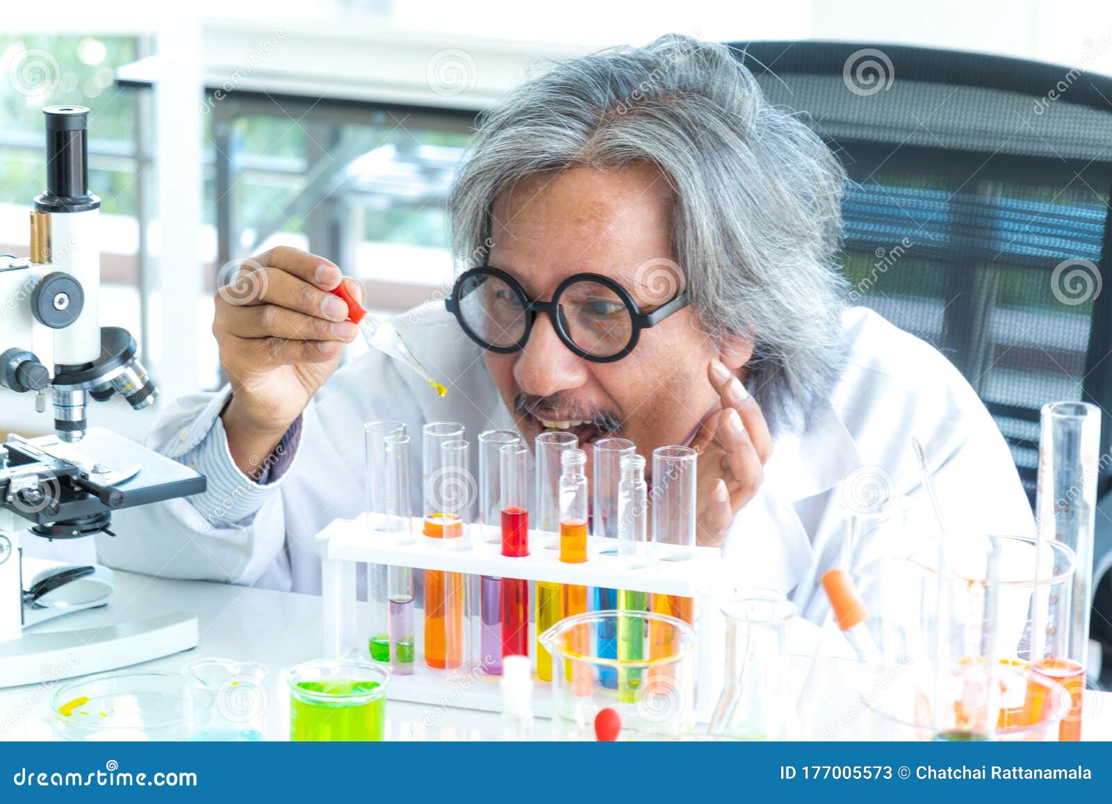 Professor Research Scientist Preparing and Analyzing Pipetting Solution ...