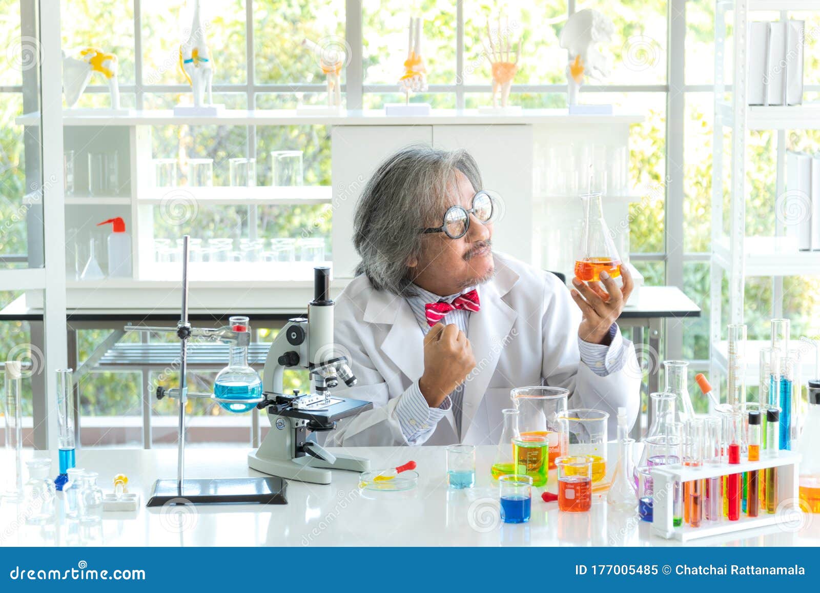 Professor Research Scientist Preparing and Analyzing Pipetting Solution ...