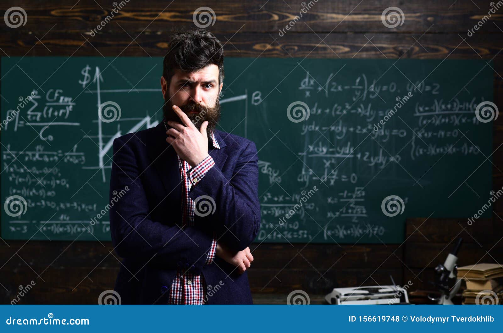 Professor and School Student at the Classroom in a School. Students are ...