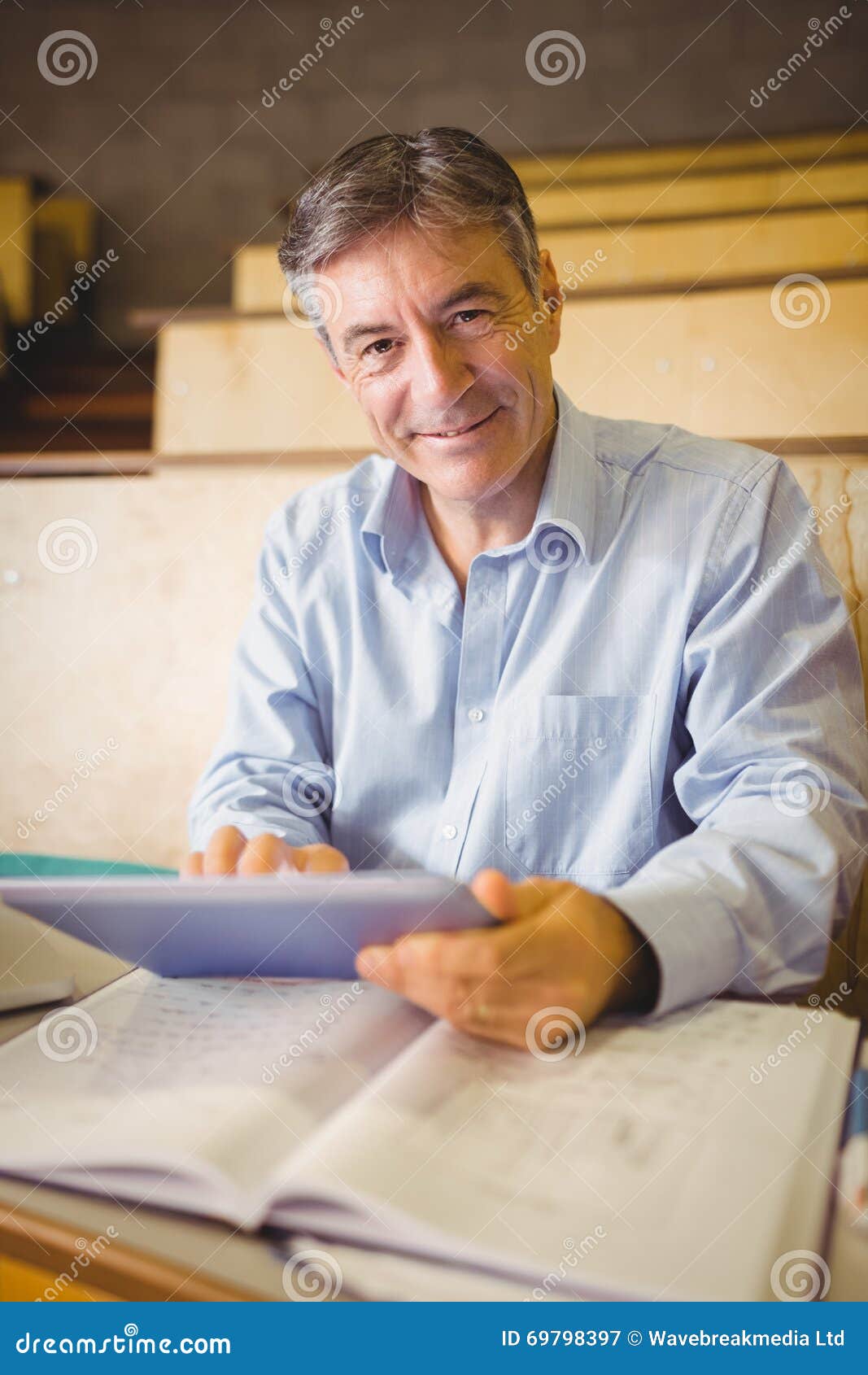 Professor Sitting at Desk Using Digital Tablet Stock Image - Image of ...