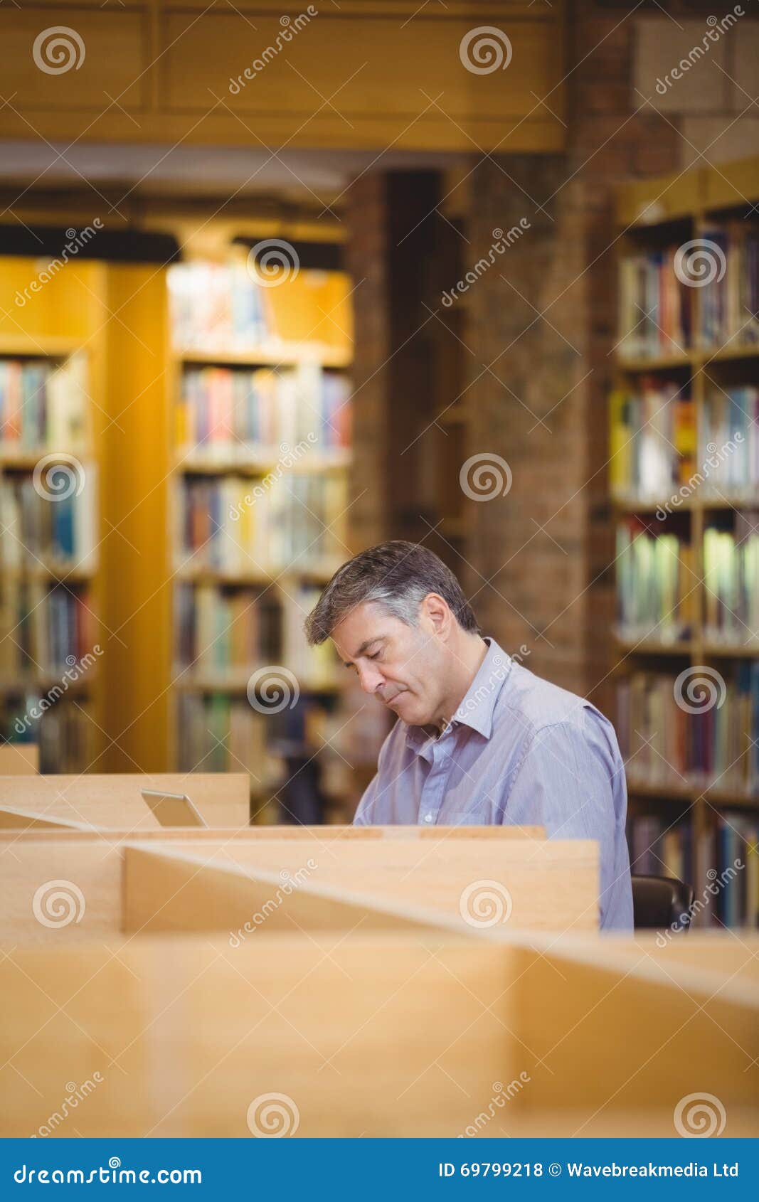 Professor Sitting on Desk Using His Laptop Stock Photo - Image of notes ...