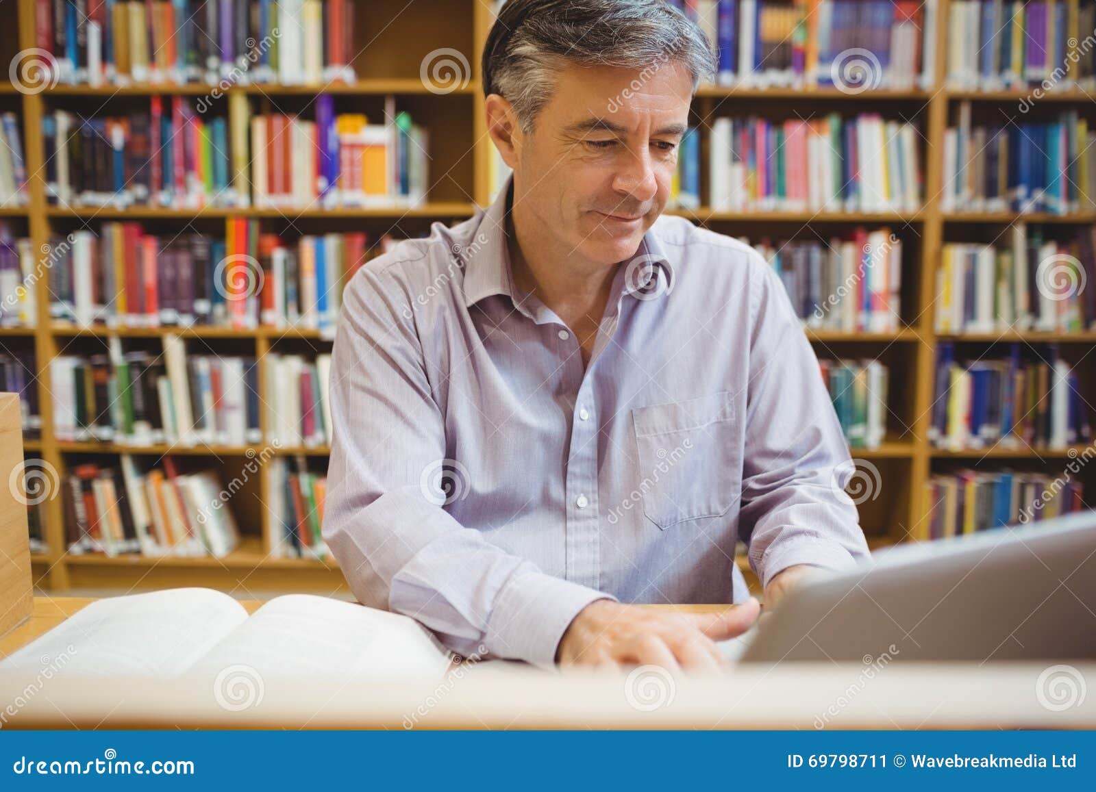 Professor Sitting at Desk Using Laptop Stock Image - Image of mature ...