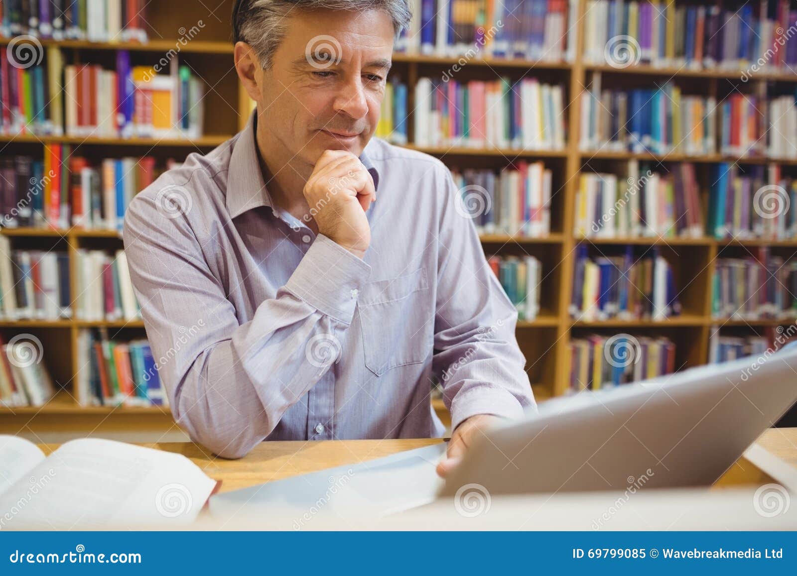 Professor Sitting at Desk Using Laptop Stock Image - Image of internet ...