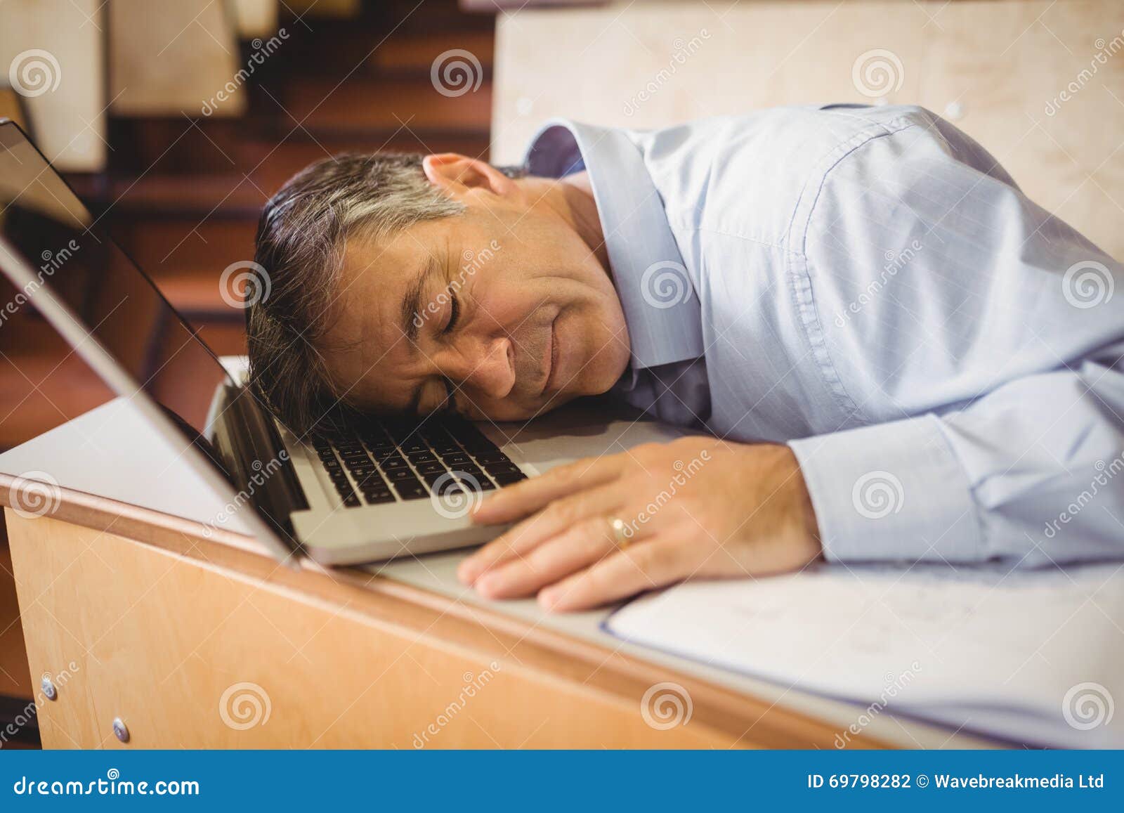 Professor Sleeping on His Laptop at Desk Stock Photo - Image of ...