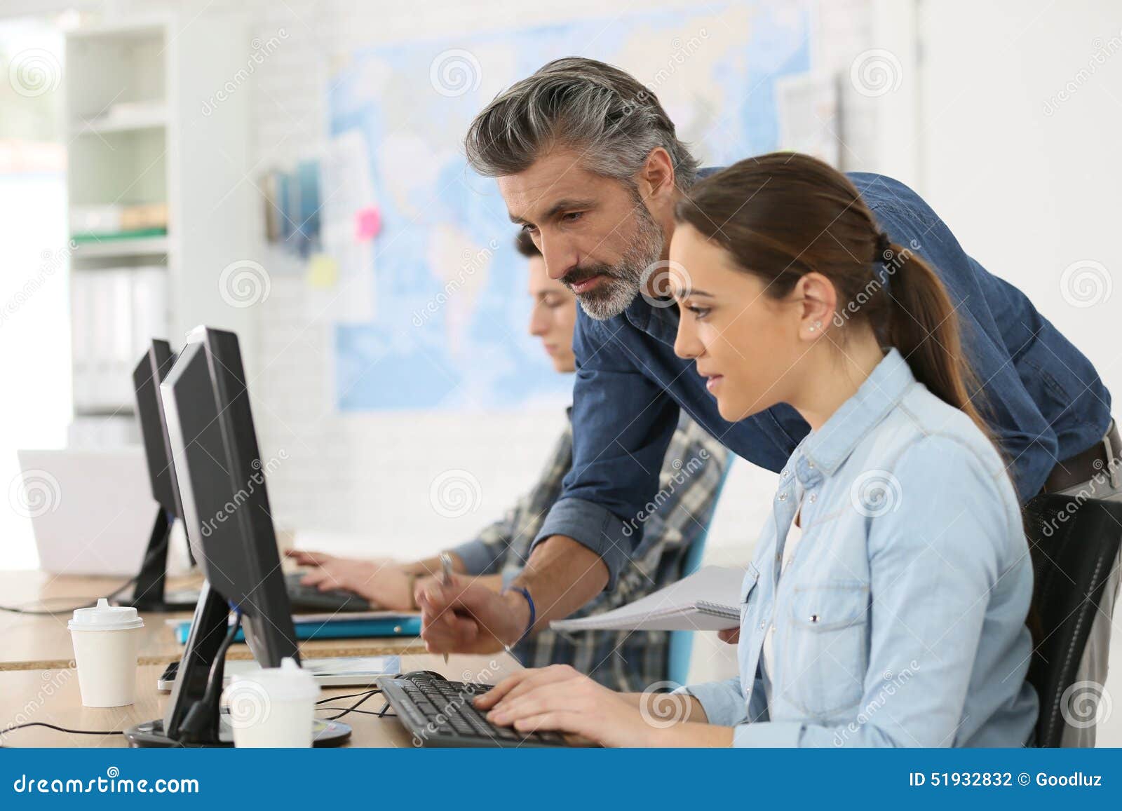 Professor with Students Working on Computer Stock Photo - Image of ...