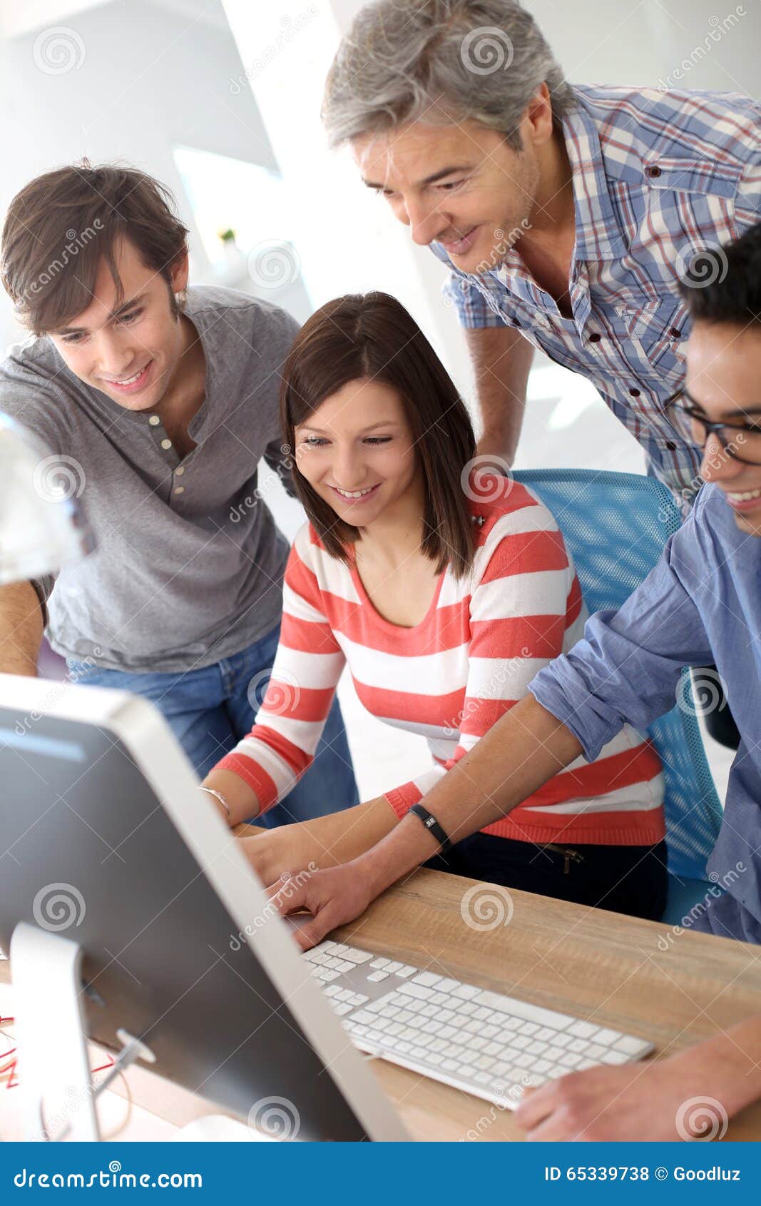 Professor with Students Working Together Stock Photo - Image of project ...