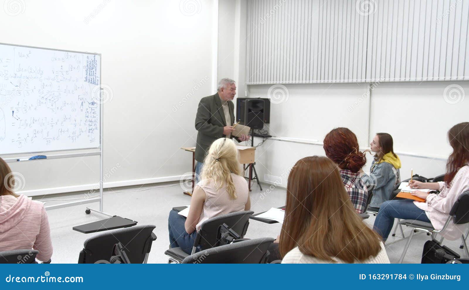 Professor Teach a Class with Group of Students in University. Stock ...