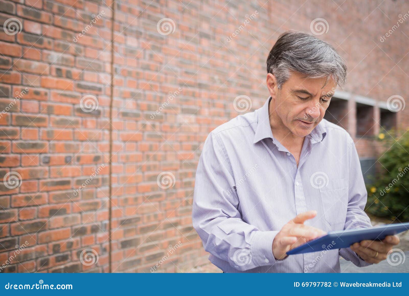 Professor Using Digital Tablet in Campus Stock Photo - Image of ...