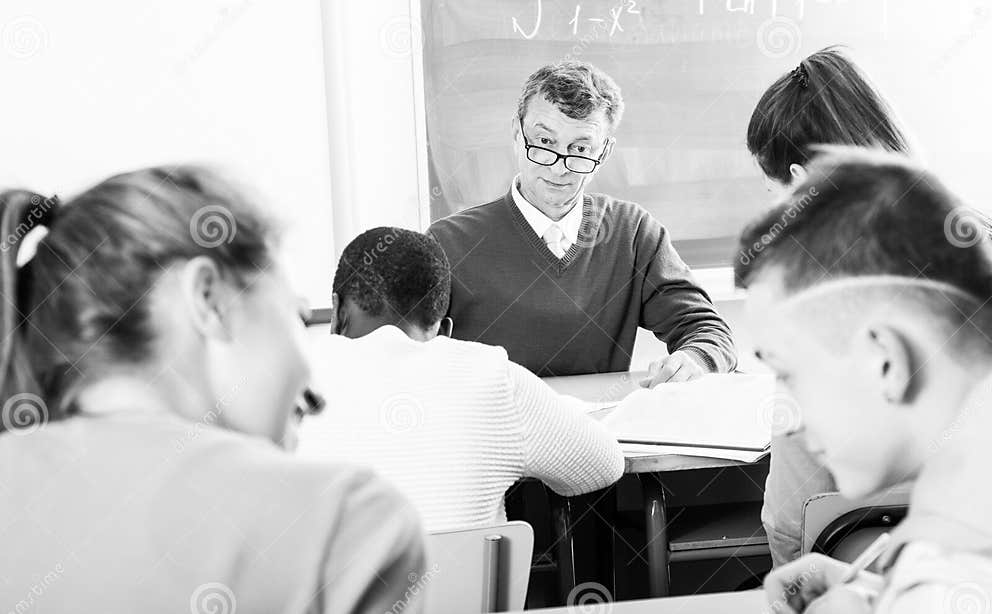 Professor Watching As Student Write Off on Exams Stock Image - Image of ...