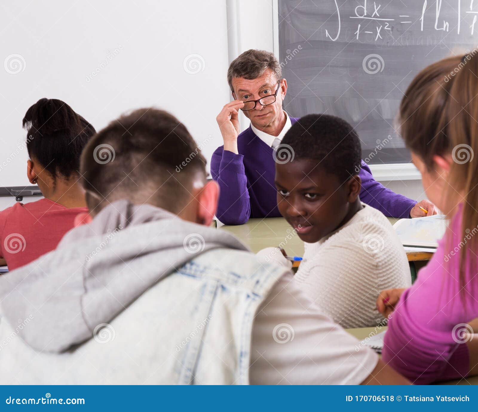 Professor Watching As Student Write Off on Exams Stock Photo - Image of ...