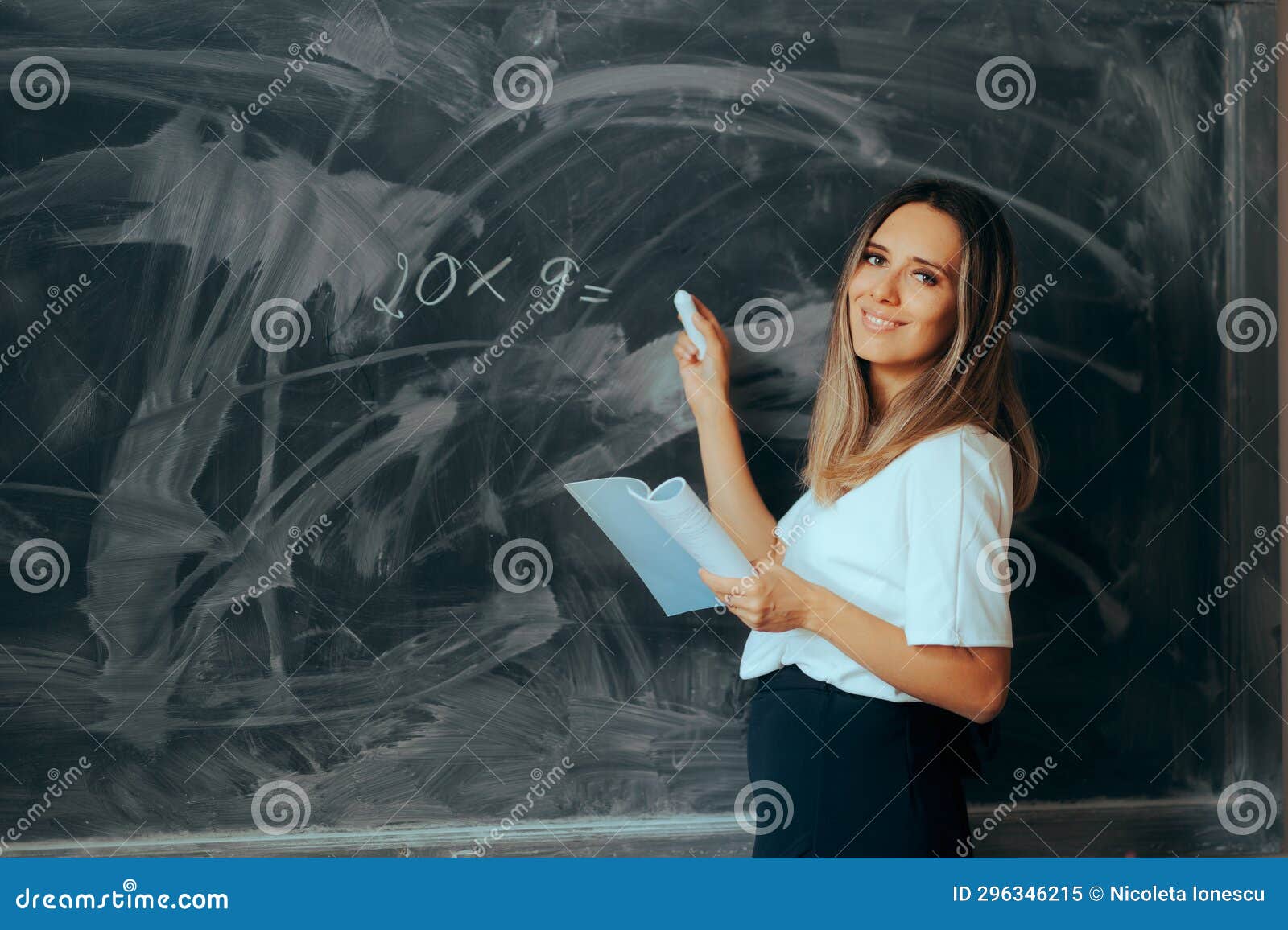 Math Teacher Writing a Simple Exercise on a Blackboard Stock Image ...