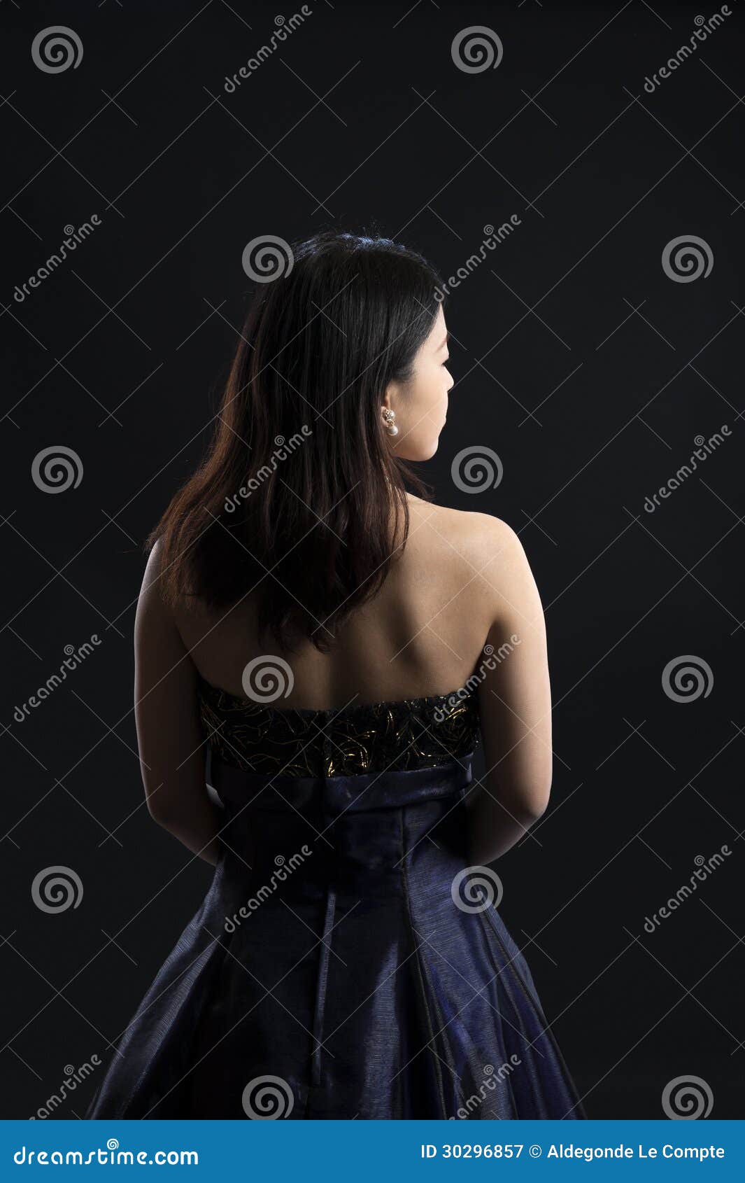 Back View Of A Young Asian Woman On Black Stock Image - Image: 30296857