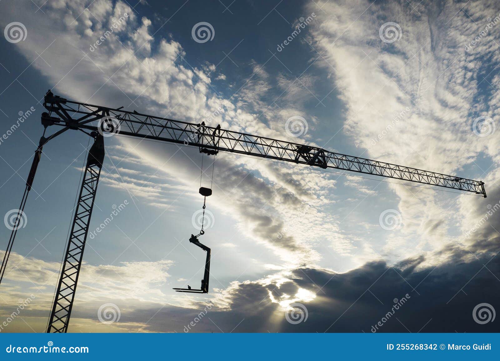 The Profile of a Construction Crane at Sunset Stock Photo - Image of ...