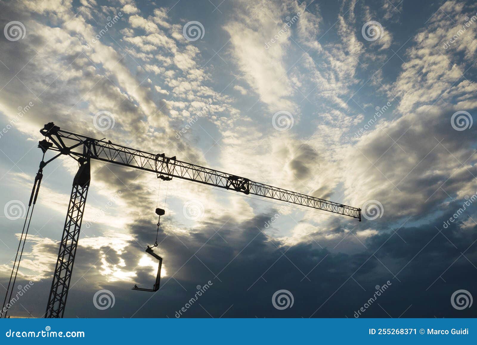 The Profile of a Construction Crane at Sunset Stock Image - Image of ...