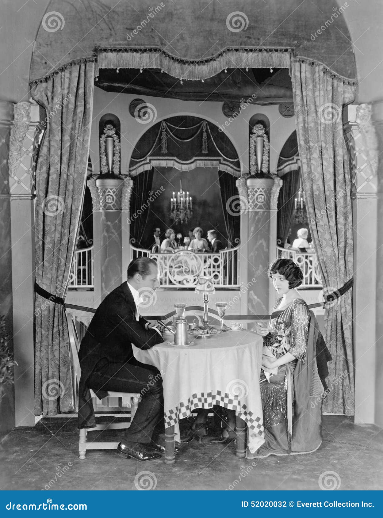 Profile of a Couple Sitting at a Table in a Restaurant Having Dinner ...