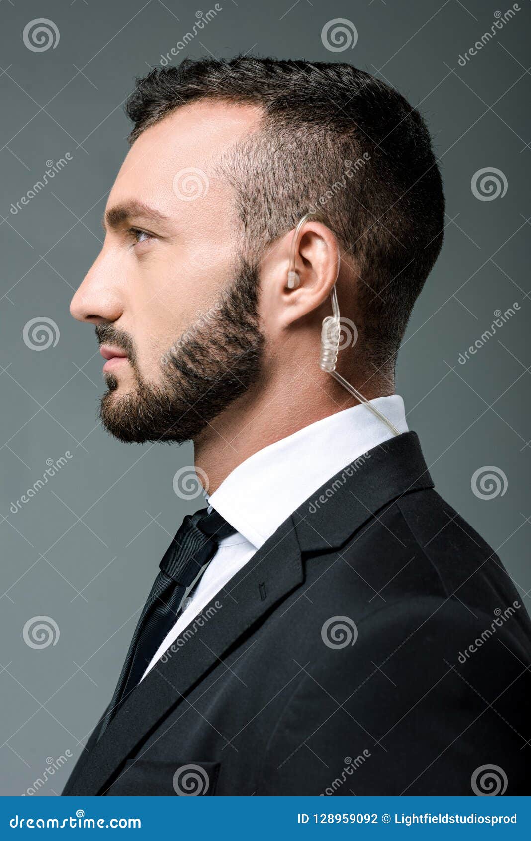 Profile of Handsome Security Guard with Security Earpiece Stock Photo ...
