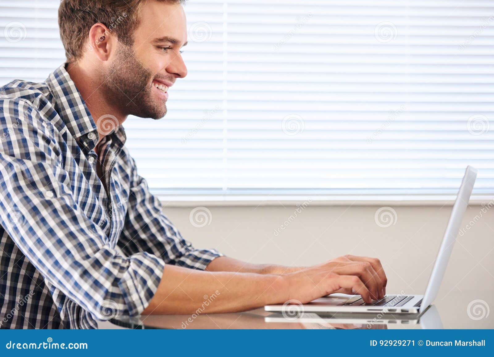 Profile Image of Handsome Groomed Man Typing on Laptop Computer Stock ...