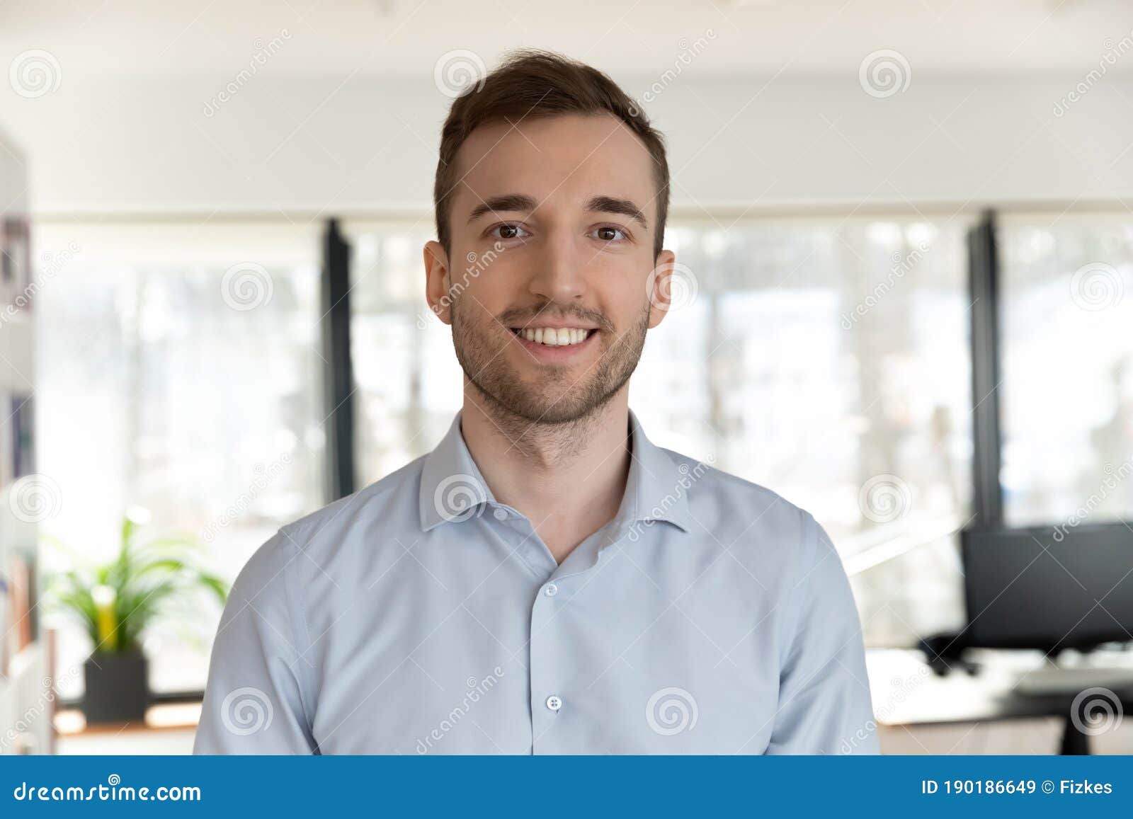 Profile Picture Of Caucasian Male Employee Posing In Office Stock Image