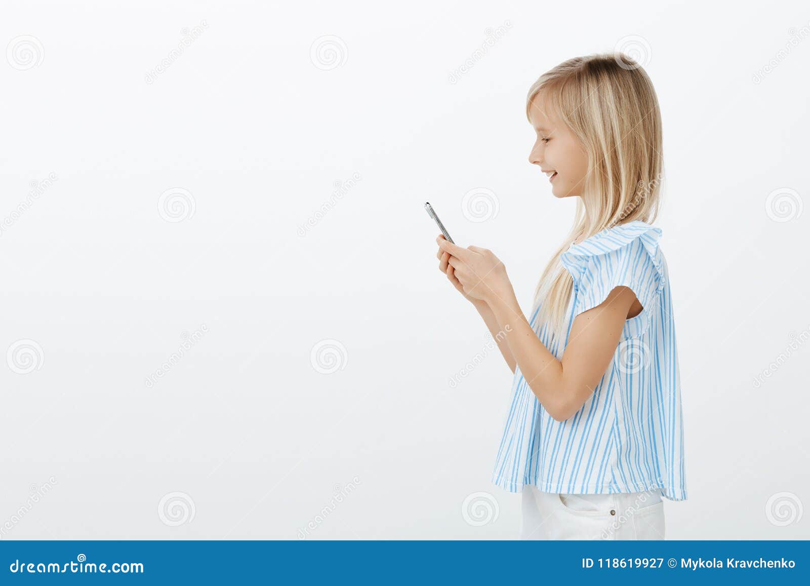 Profile Portrait Of Positive Joyful Fair Haired Woman In Trendy Blue