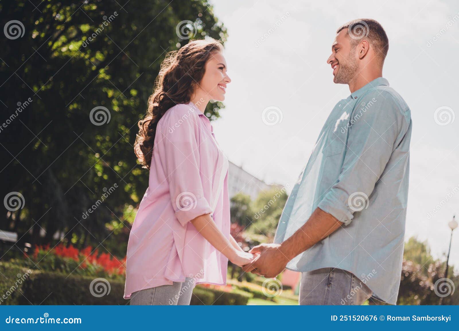 Profile Portrait Of Two Idyllic Cheerful Partners Hold Arms Look Each
