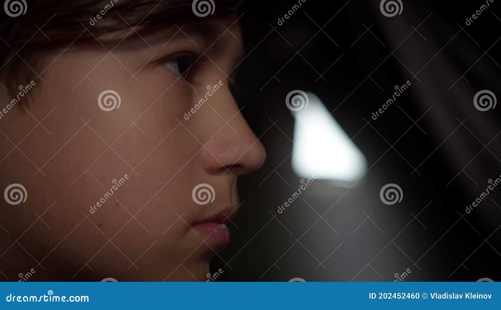 Profile of a Serious Sad Boy Thinking about Something, Indoors, Moving ...