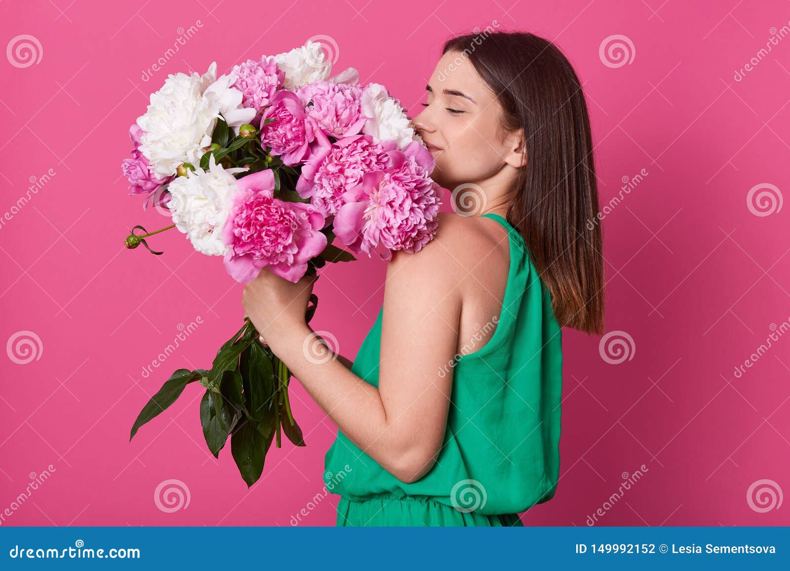 Profile Shot Of Beautiful Brunette Girl Holding With White And Rose