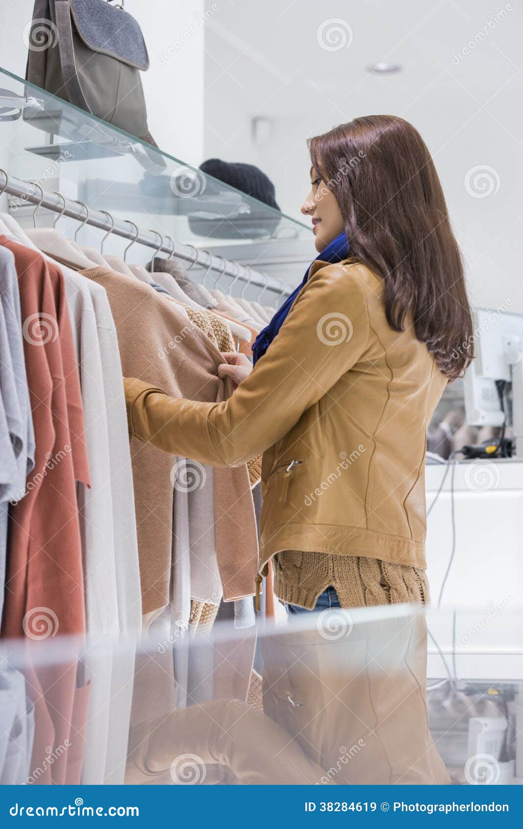 Profile Shot of Woman Selecting Sweater in Store Stock Image - Image of ...