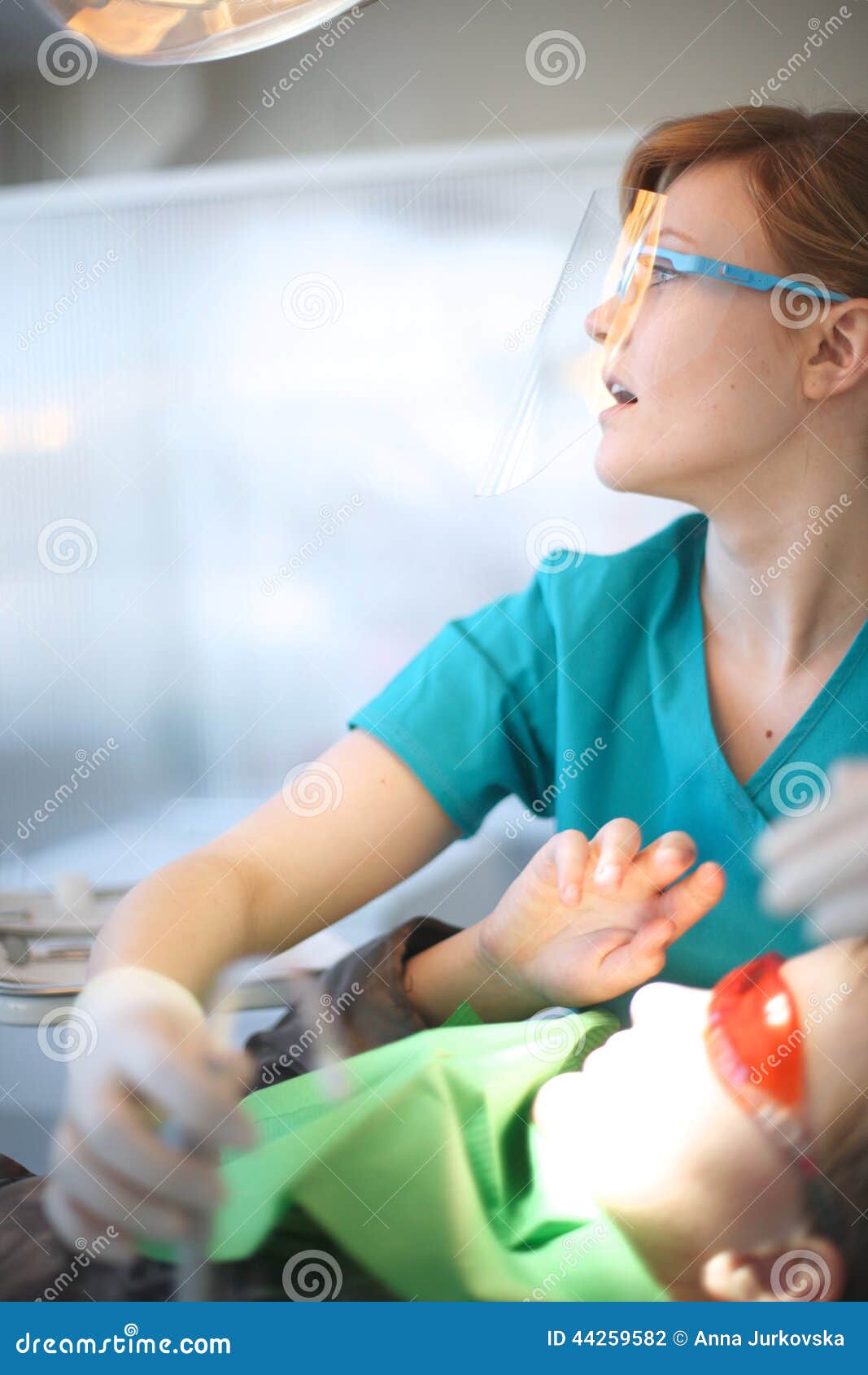 Profile of Surprised Young Dentist at Work Stock Photo - Image of lamp ...