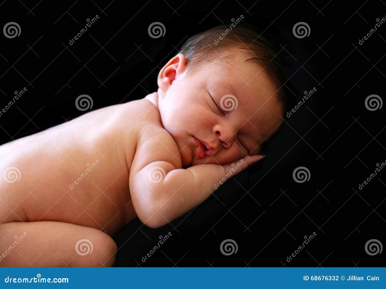 Profile View of a Beautiful Sleeping Newborn Baby on a Black Background ...