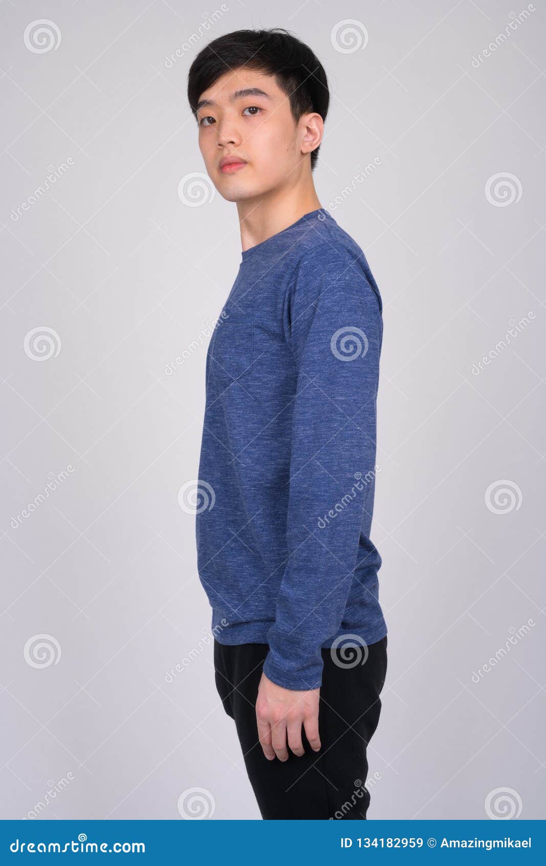 Profile View of Young Asian Man Looking at Camera Stock Image - Image ...