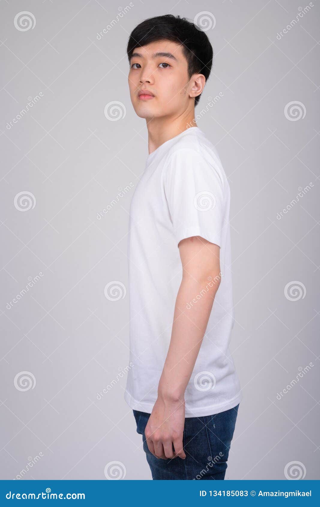 Profile View of Young Asian Man Looking at Camera Stock Image - Image ...