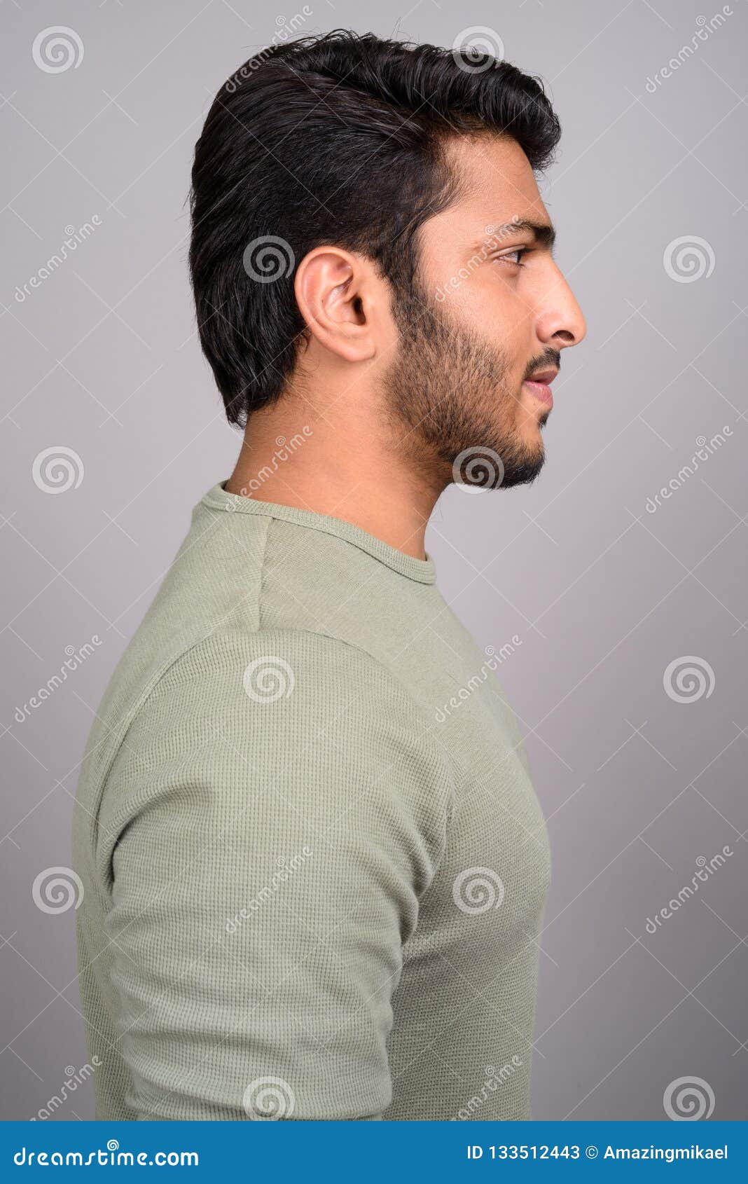 Profile View of Young Handsome Indian Man Against Gray Background Stock ...