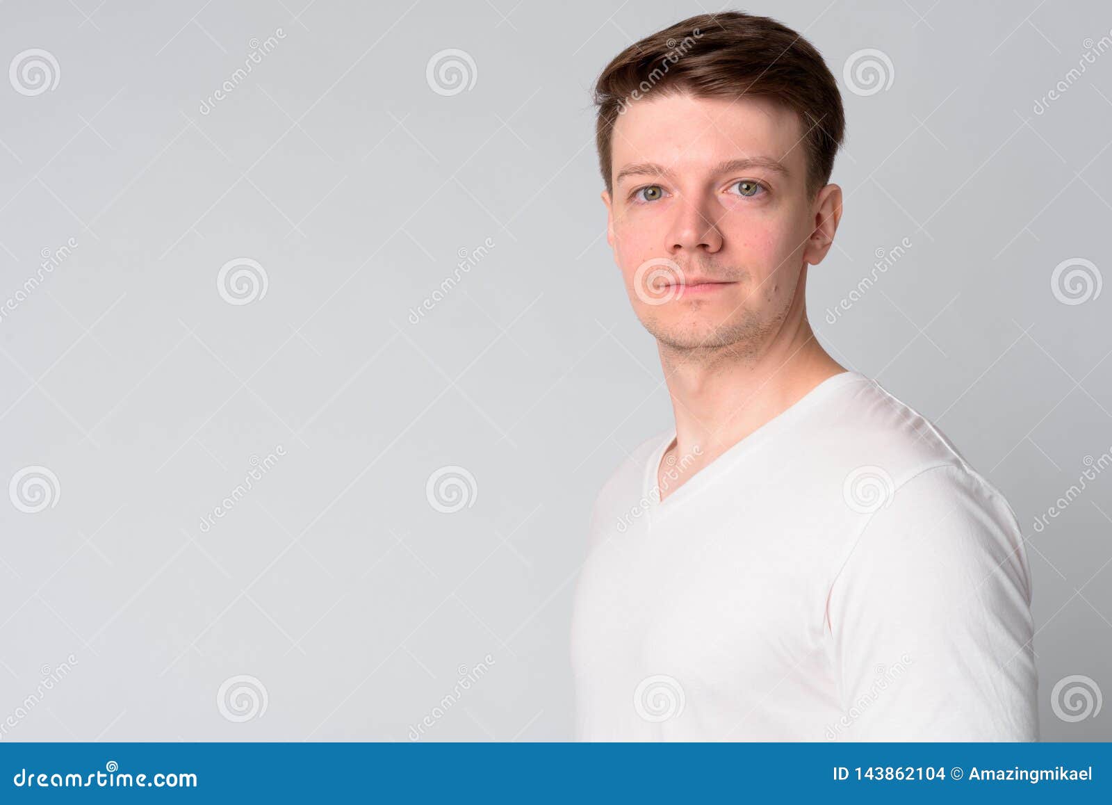 Profile View of Young Handsome Man Looking at Camera Stock Photo ...
