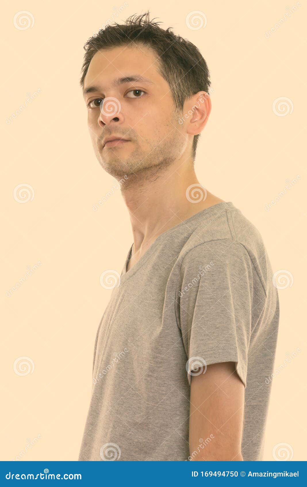 Profile View of Young Man Looking at Camera Stock Photo - Image of ...