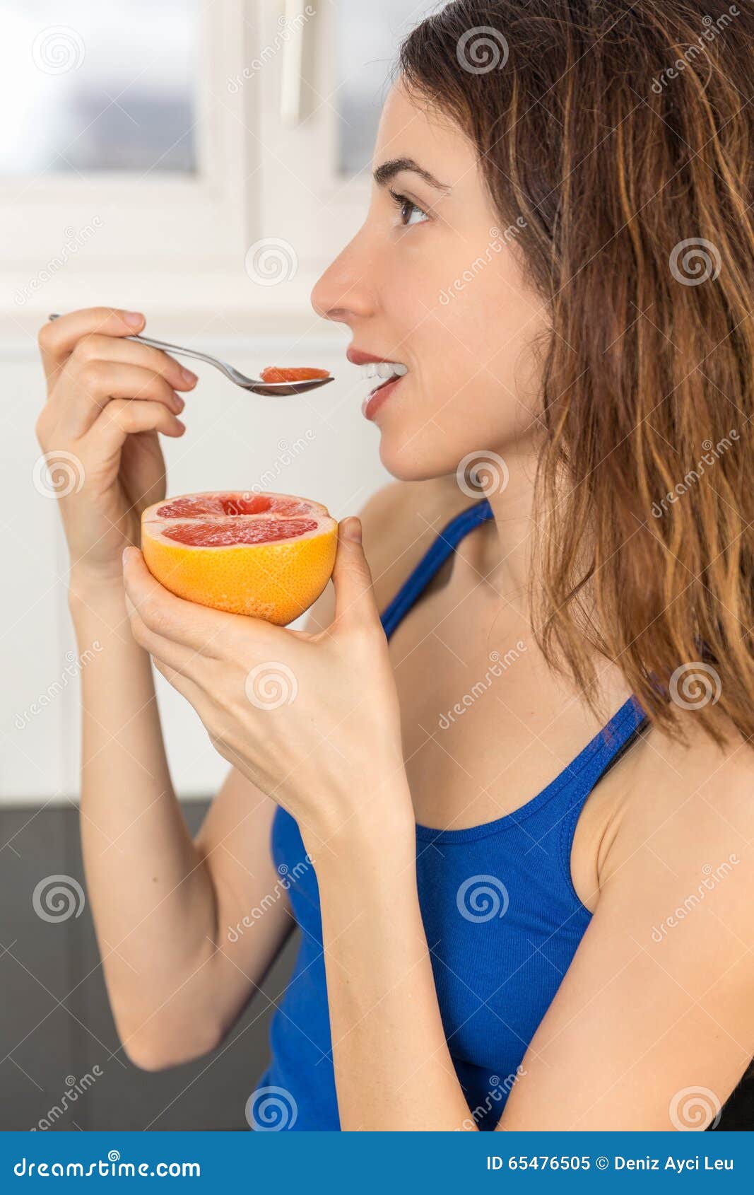 Profile of Woman Eating Fruit Stock Image - Image of healthy, kitchen ...