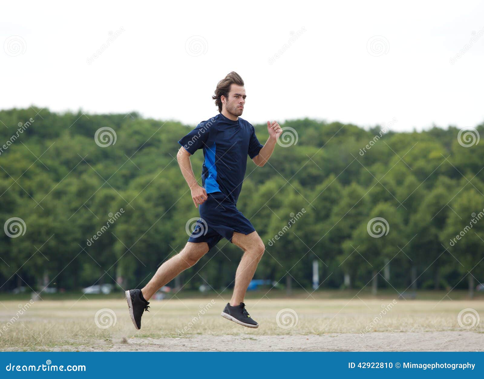Profile of a Young Man Jogging Outdoors Stock Photo - Image of male ...