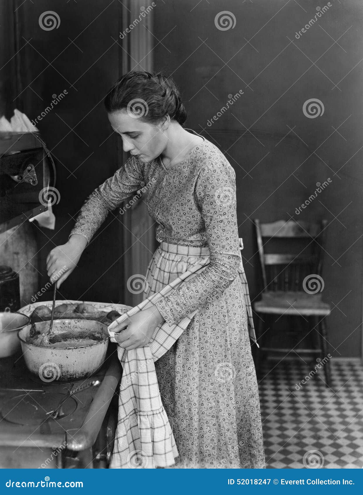 Profile of a Young Woman Cooking Food in the Kitchen Stock Image ...