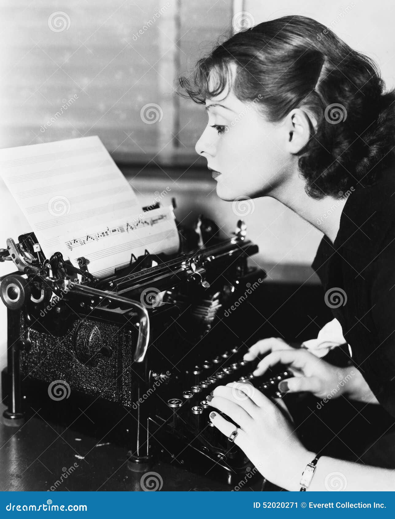 Profile of a Young Woman Typing Musical Notes with a Typewriter Stock ...