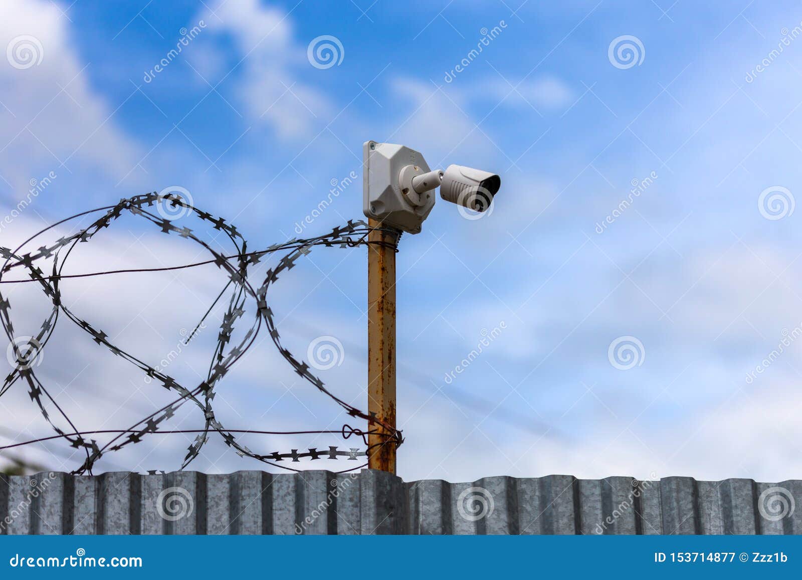 Profiled Sheet Fence with Cheap Surveillance Camera and Barbwire with ...