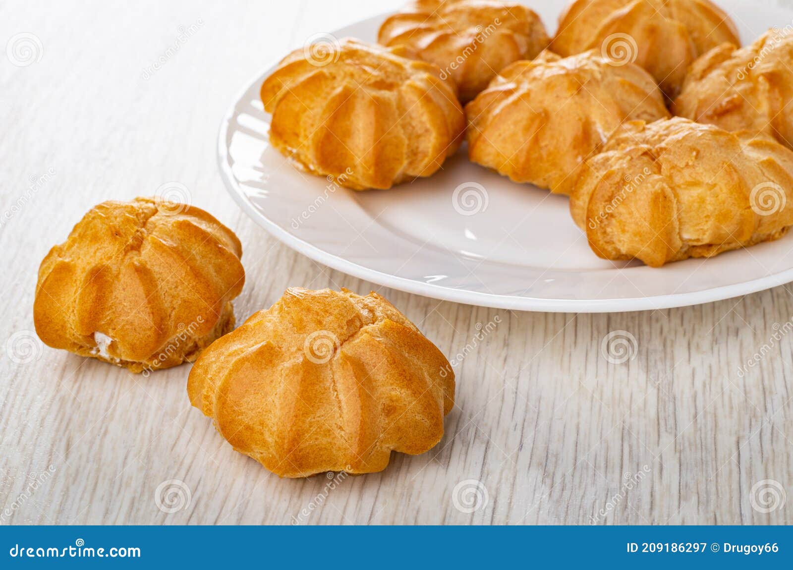 Profiteroles with Cream in Plate Profiteroles on Table Stock Image ...