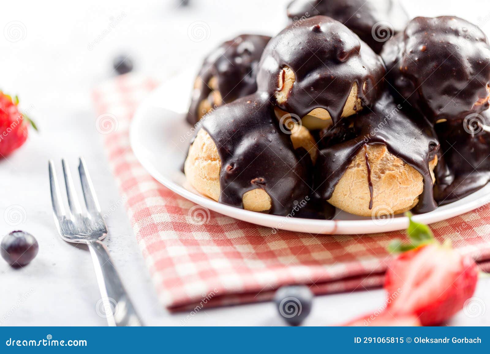 Profitrolls Decorated with Chocolate on a Light Background Stock Image ...