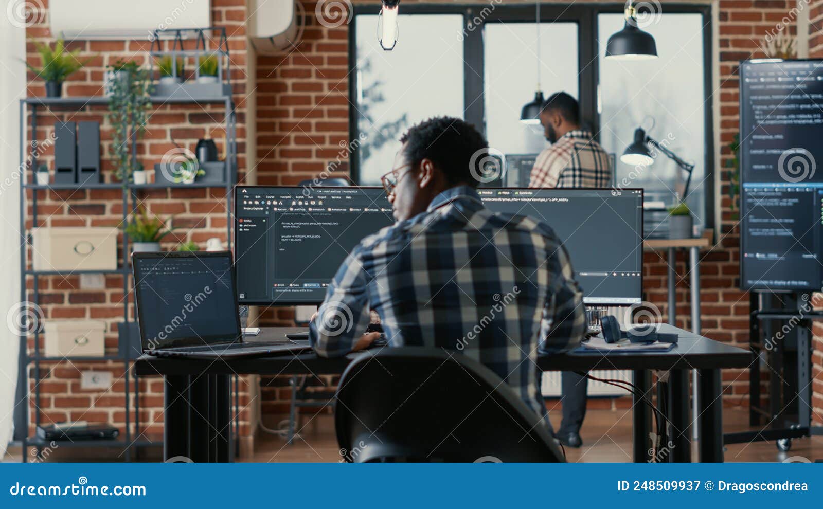 Programer Coding on Laptop Sitting Down at Desk with Computer Screens Parsing Code Stock Image ...