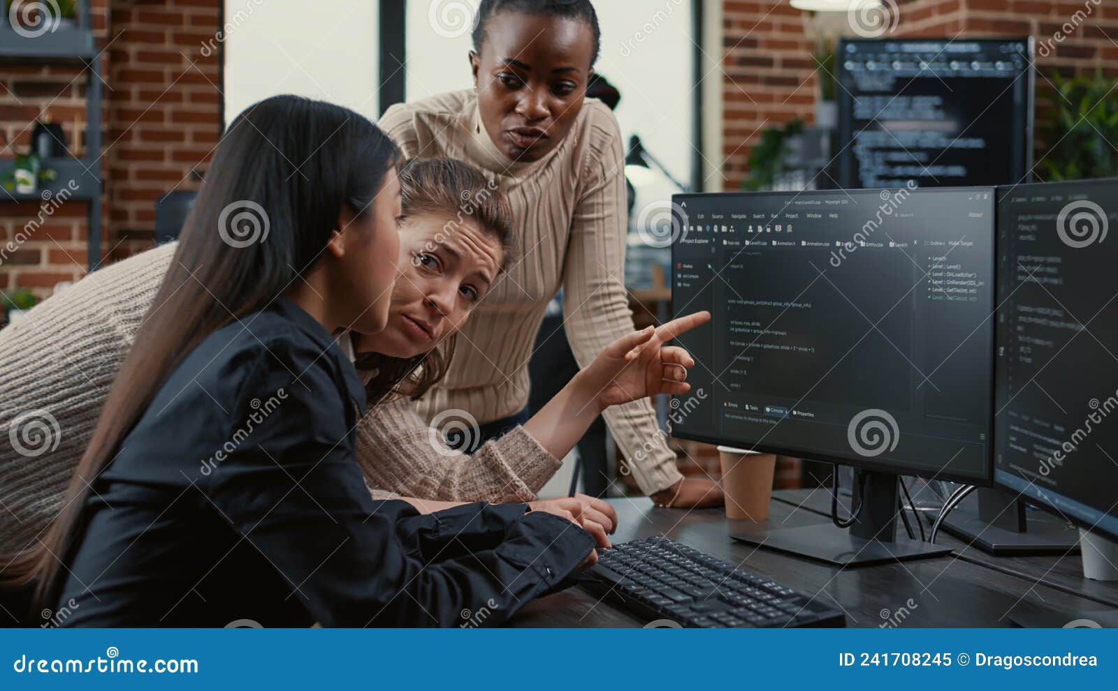 Programer Pointing at Computer Screen Explaining Running Code To Coworkers Brainstorming ...