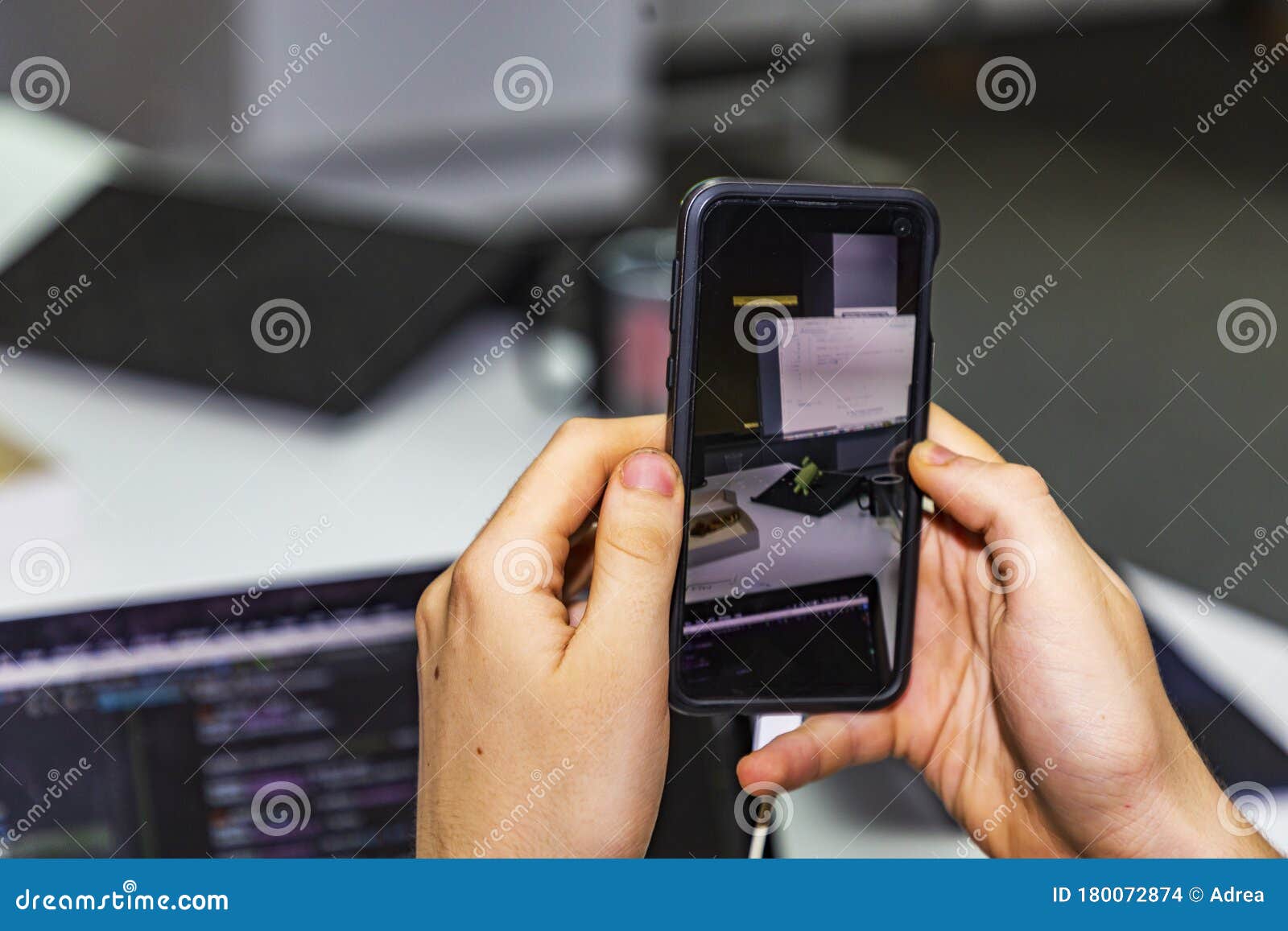 Programmer Creating Android Figurines with a Mobile Phone Editorial ...