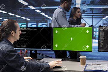 Programmer in Data Center Using Green Screen Computer To Check Server Issues Stock Image - Image ...