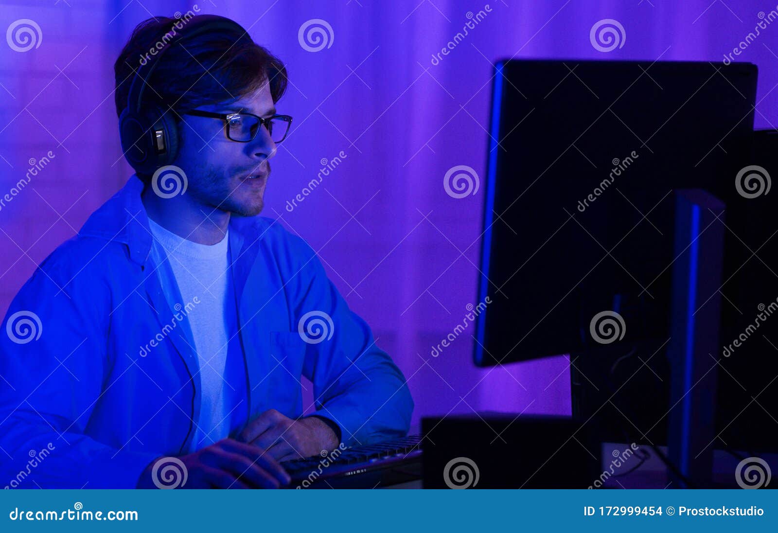 Programmer in Eyeglasses Coding on PC at Home, Low Light Stock Photo ...