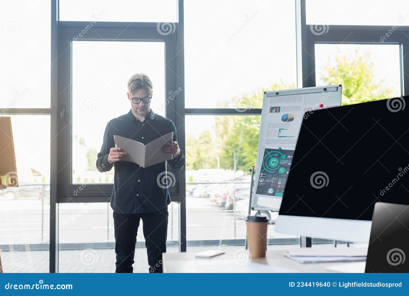 Programmer in Eyeglasses Holding Paper Folder Stock Photo - Image of ...