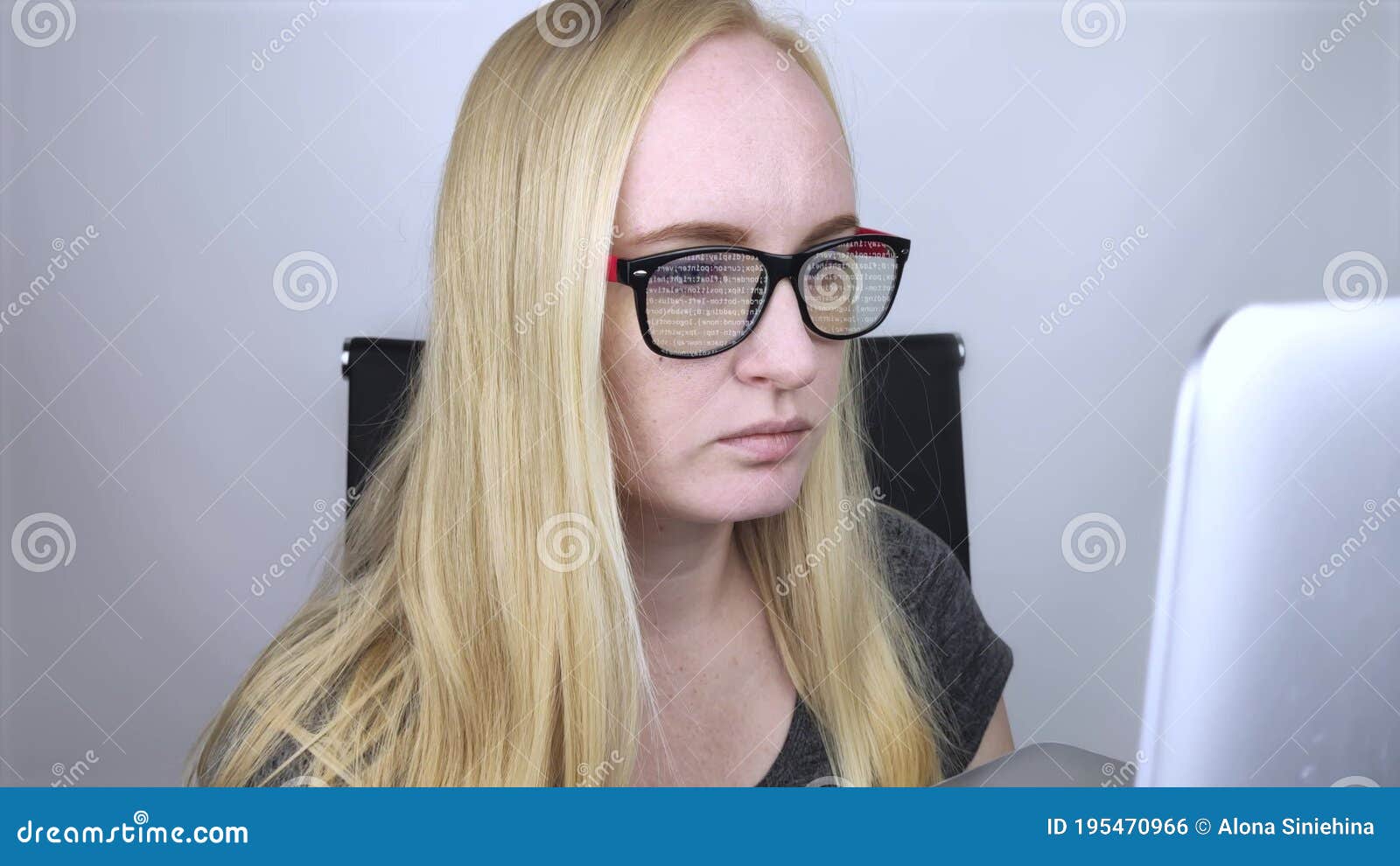 The Programmer Girl`s Glasses Reflect Moving Lines of Code. Programming, Development of ...