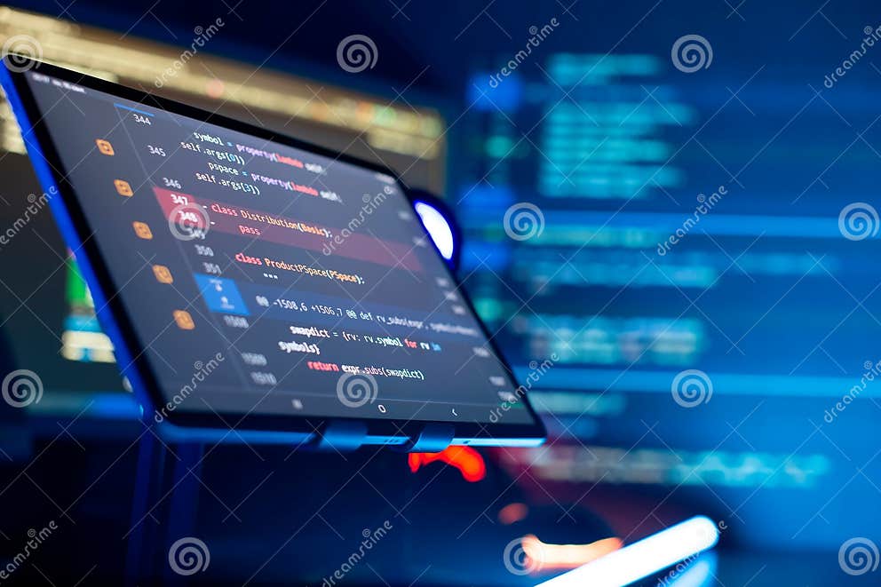 Programmer Manually Working with Program Code on a Computer at Night in a Data Center and ...