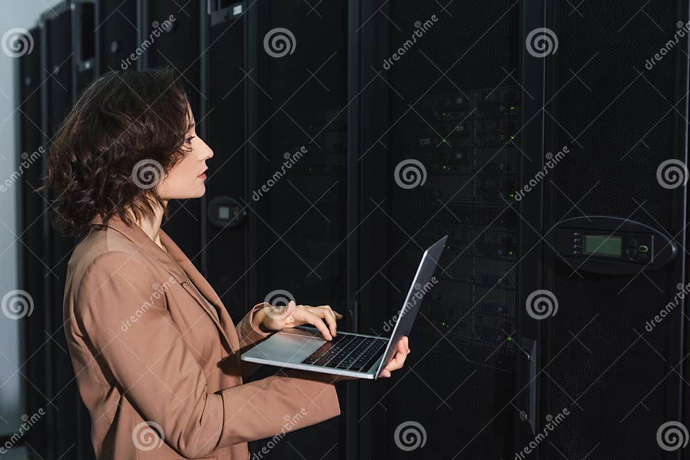Programmer Using Laptop while Checking Servers Stock Image - Image of service, engineer: 236043401